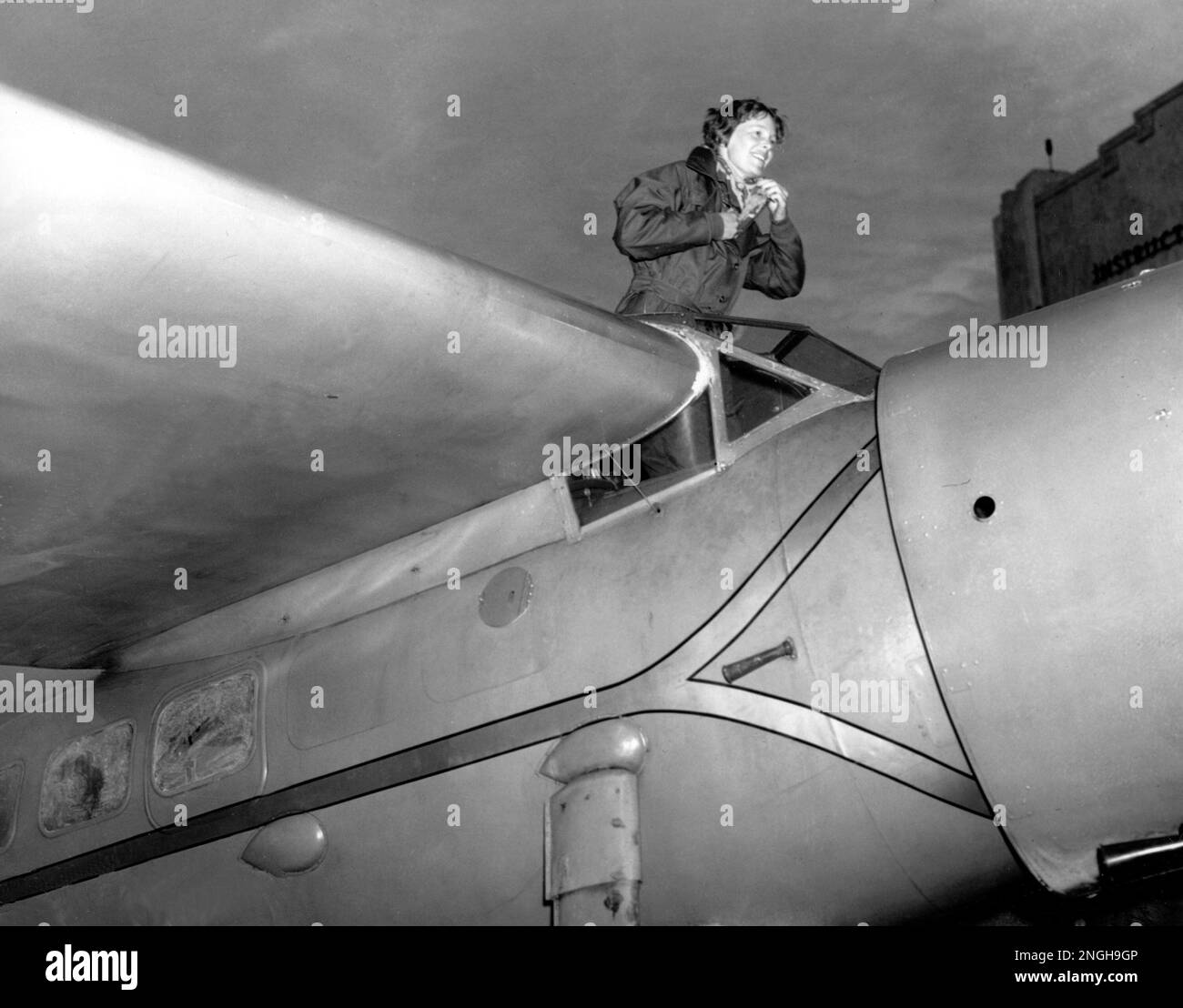 American aviatrix Amelia Earhart climbs from the cockpit of her plane ...