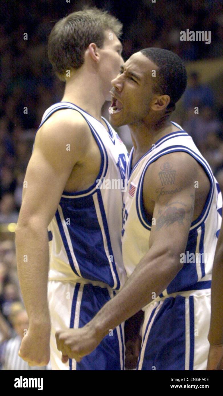 Duke's Dahntay Jones, right, bumps chests with teammate Mike Dunleavy ...