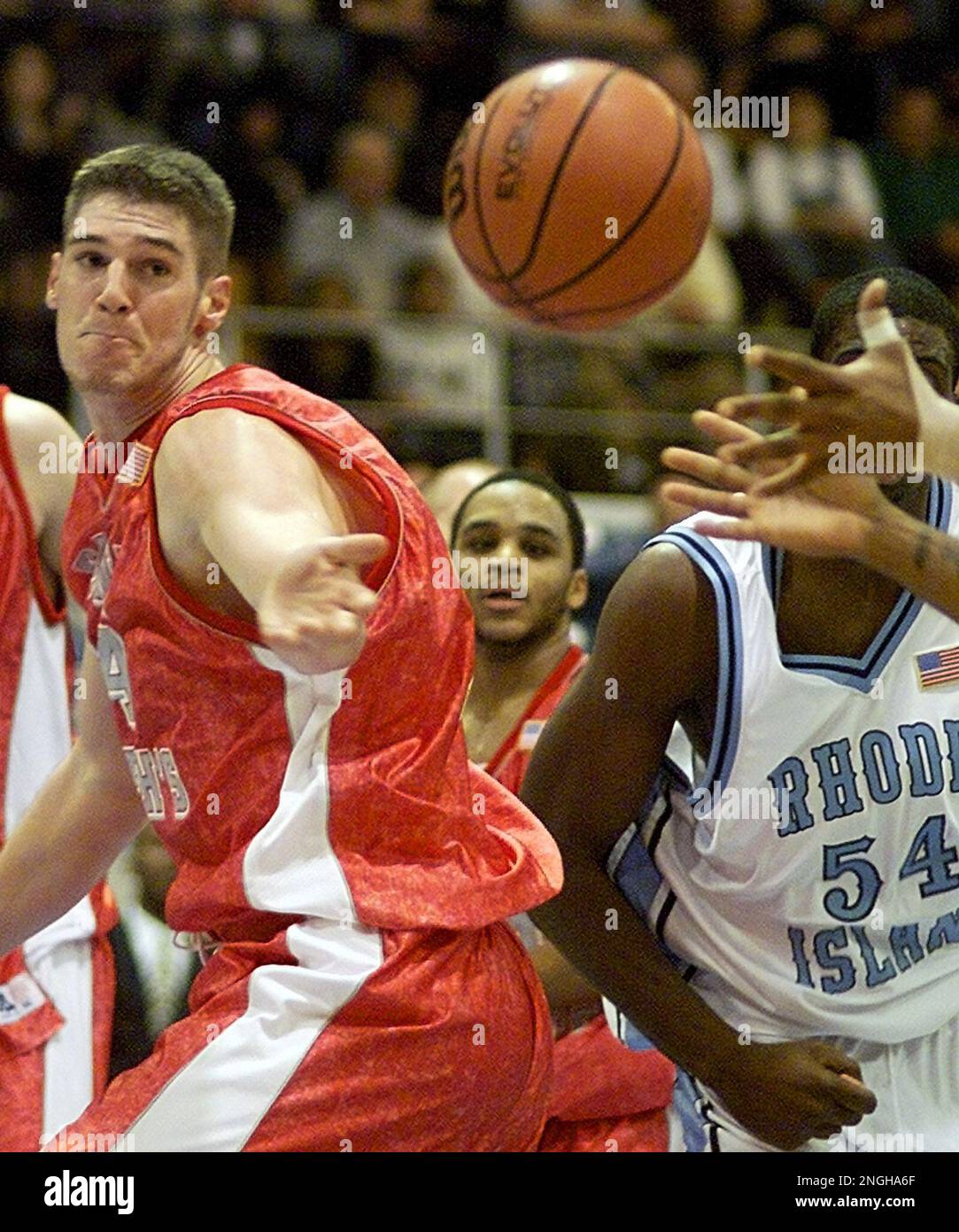 St. Joseph's' Bill Phillips, left, reaches for a loose ball as Rhode ...