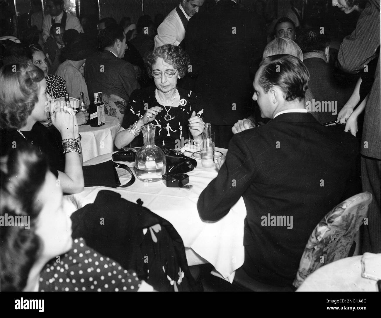 Evalyn Walsh McLean, wearing the Hope diamond, is shown during dinner ...