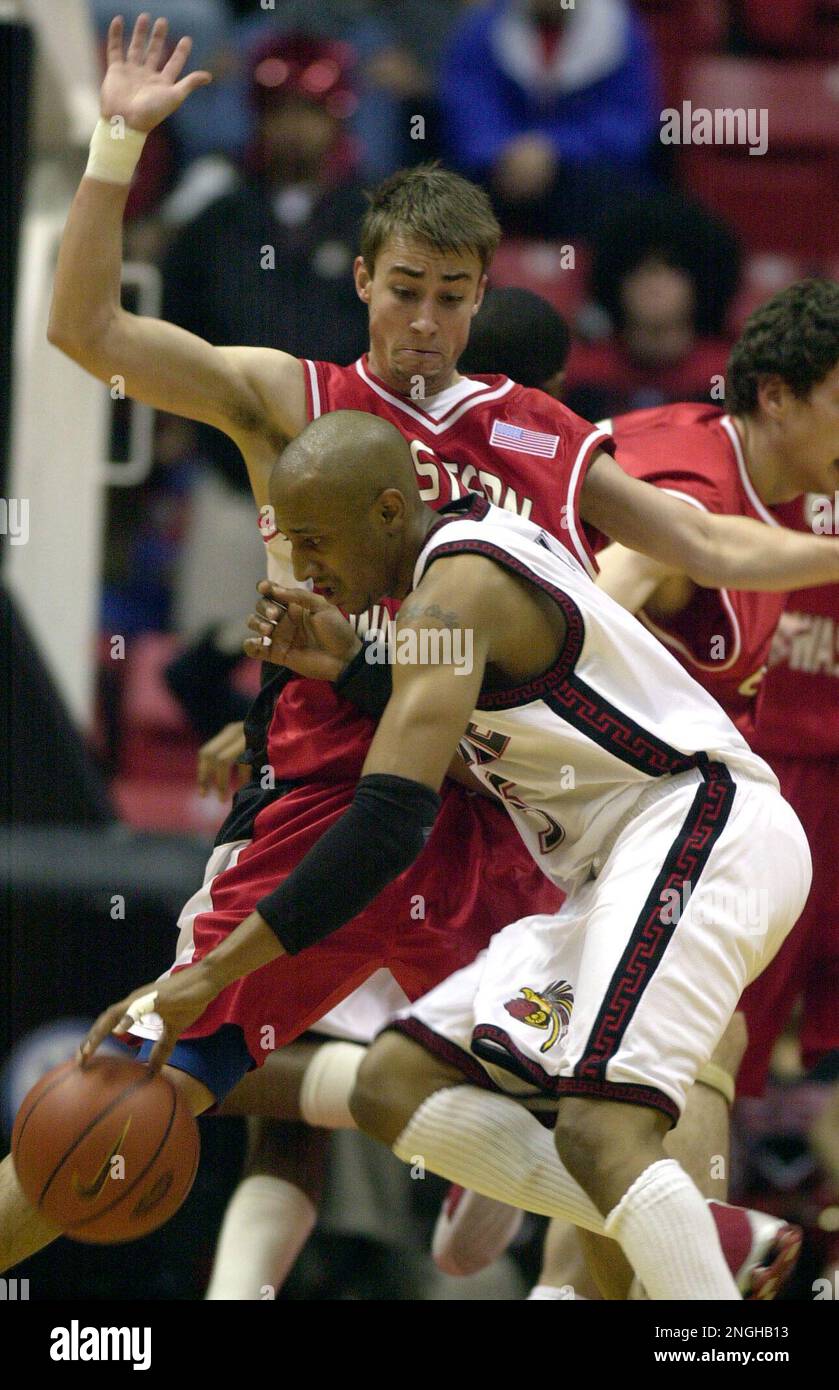 San Diego State's Al Faux plows in to Eastern Washington's Jason Lewis ...