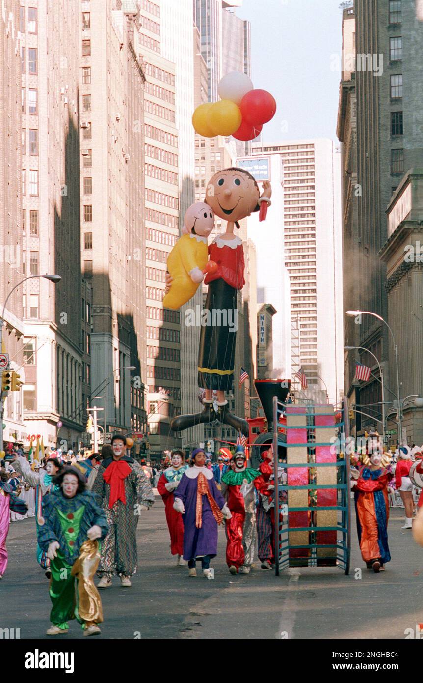 The redesigned balloon of Olive Oyl, holding Swee' Pea, floats behind a ...