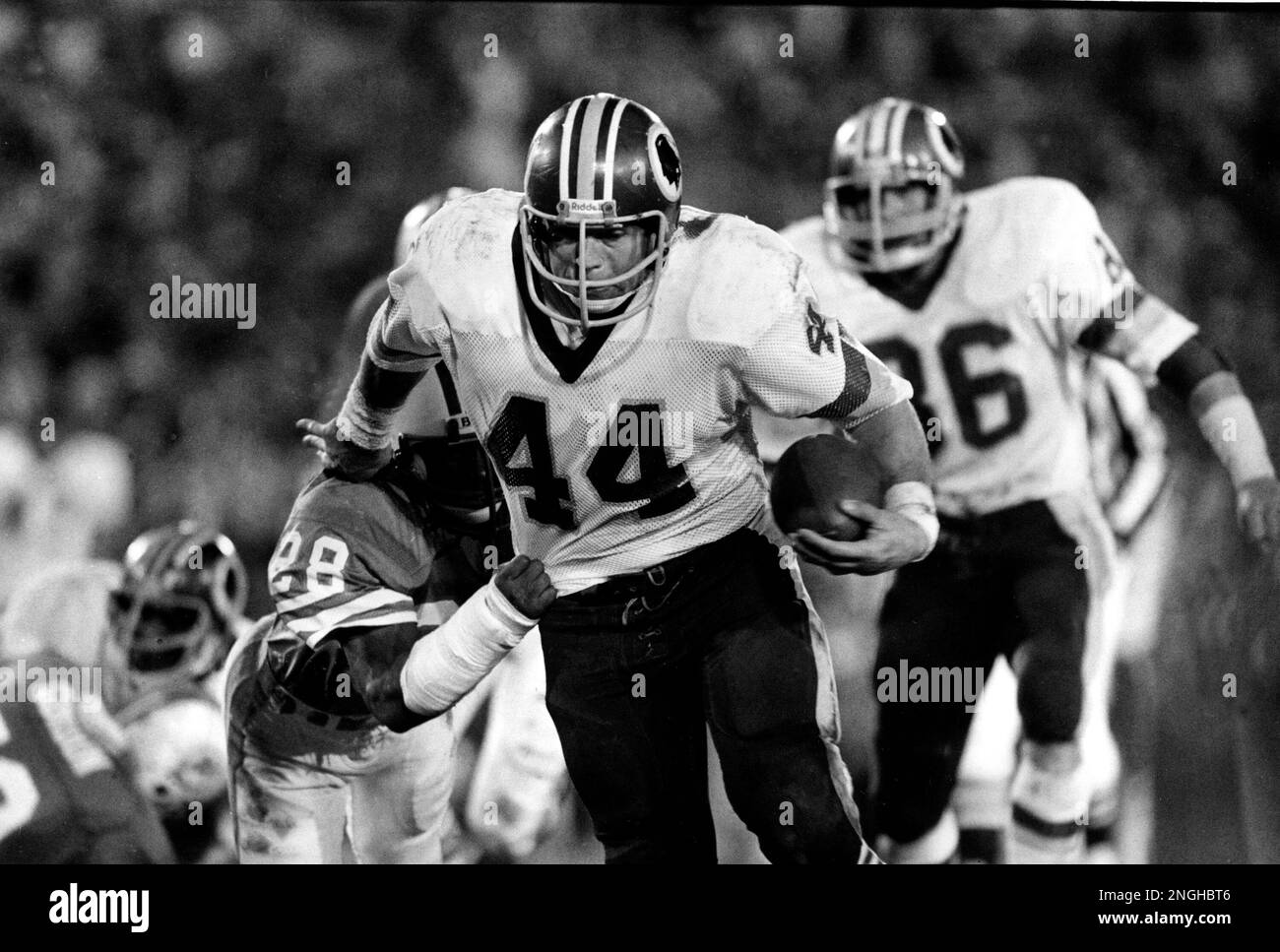 Washington Redskins running back John Riggins (44) eludes tackle by Don ...