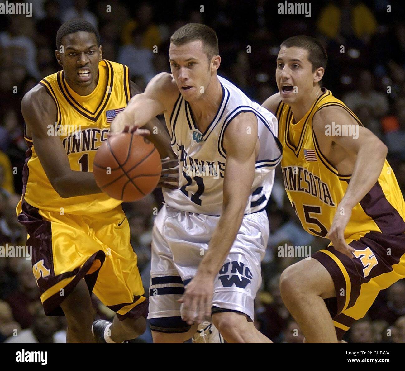 North Carolina-Wilmington's Tim Burnette, center, advances the ball ...