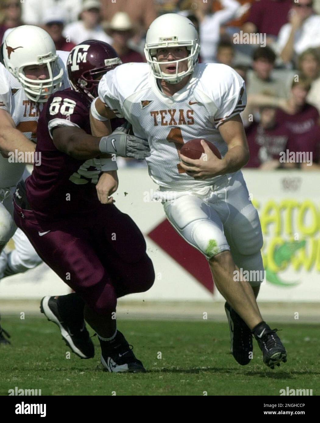 Texas quarterback Chris Simms (1) rushes for a gain as Texas A&M's ...