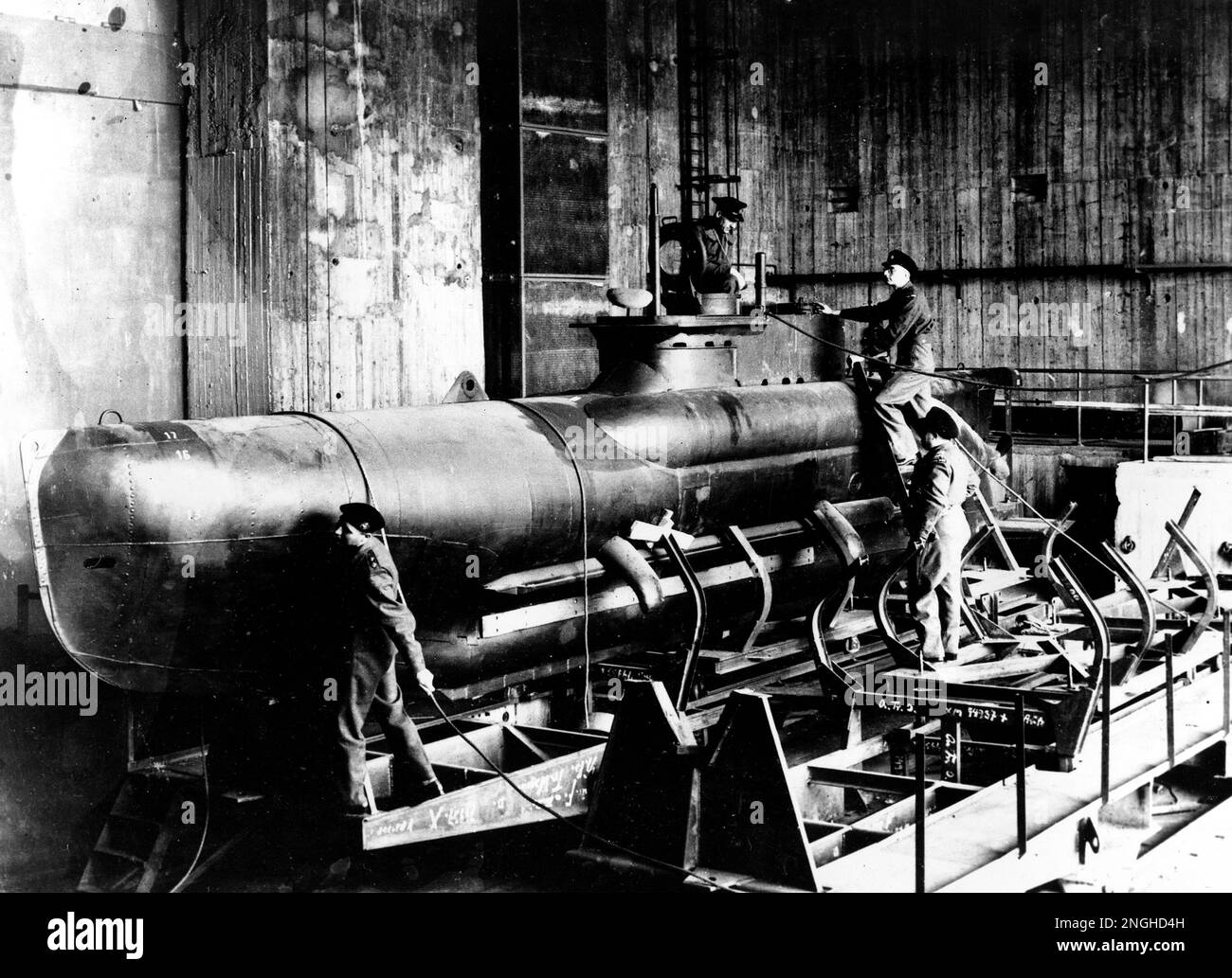 British naval officers inspect a completed two-man Midget U-Boat in a ...