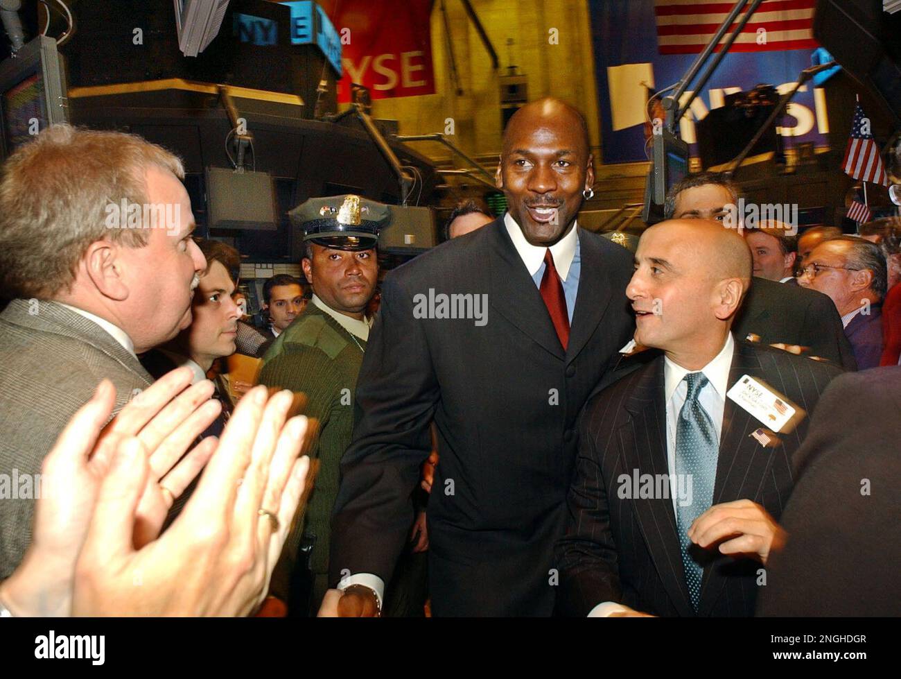 Washington Wizards' Michael Jordan, center, is escorted around the New ...