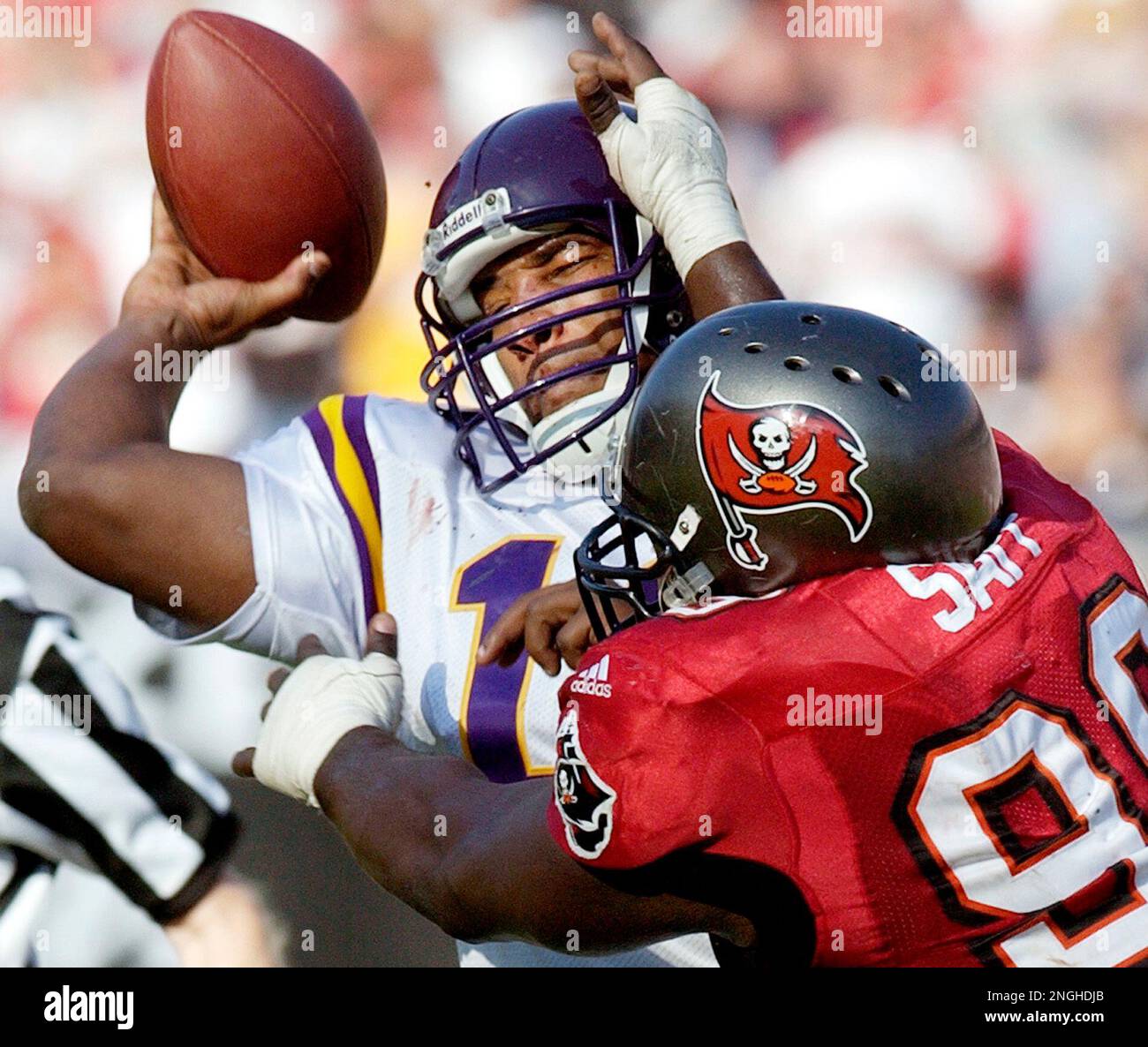 Tampa Bay Buccaneers' Warren Sapp (99) pressures Minnesota Vikings ...