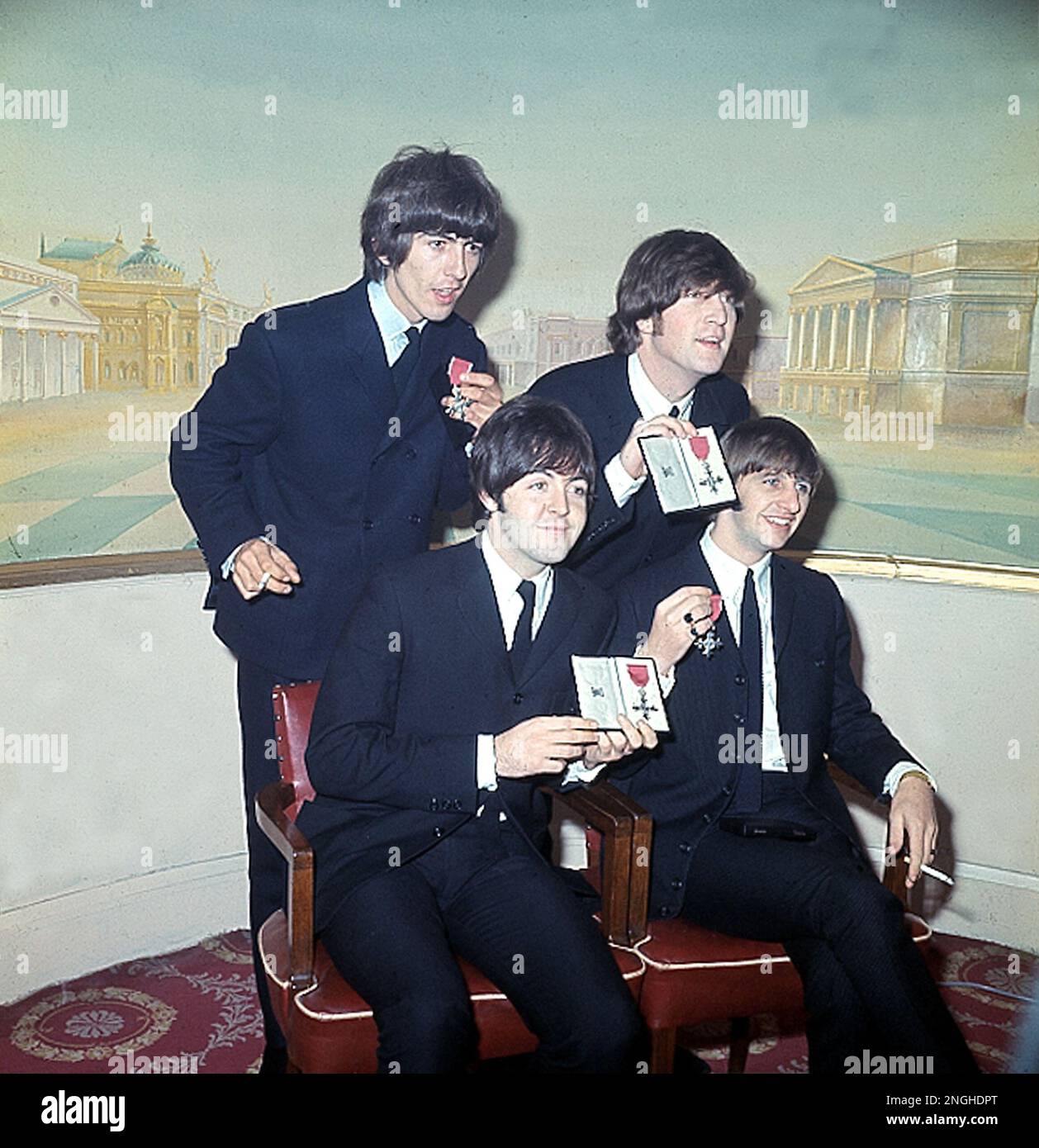The Beatles show their MBE medals during a news conference in London ...