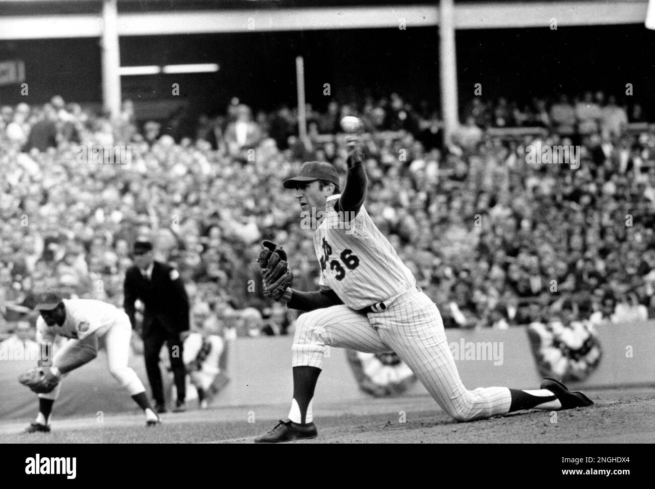The New York Mets pitcher Jerry Koosman (36) follows through on a left ...