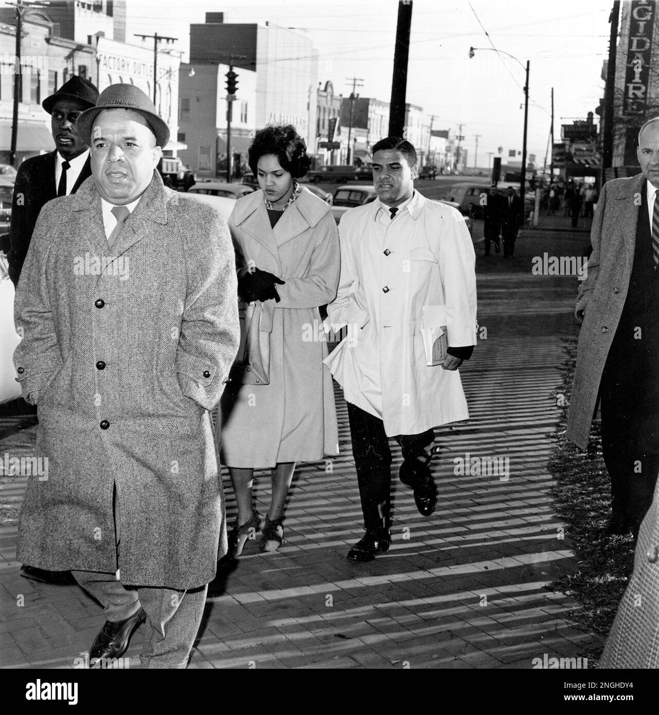 Alfred Holmes, left, escorts his son Hamilton Holmes, right, and ...