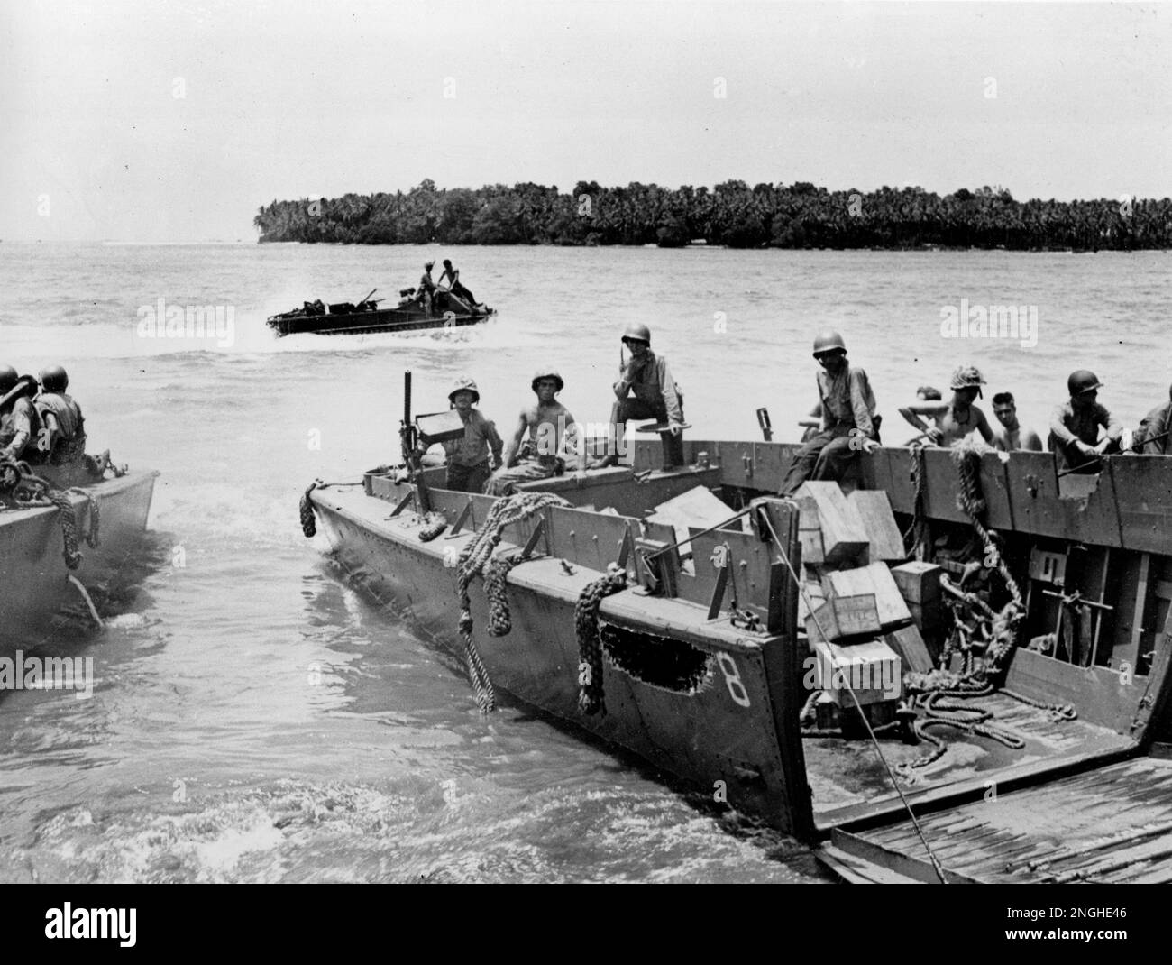 U.S. forces unload supplies from landing barges on Bougainville Island ...