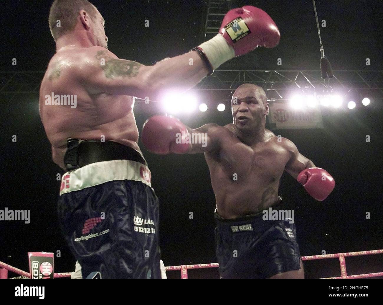 Boxer Mike Tyson, right, from the USA throws a right punch at Danish ...