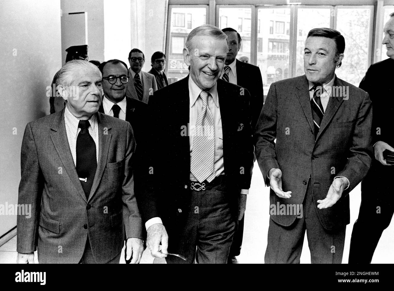 New York City Mayor Abraham Beame, left, walks with actor-dancers Fred ...