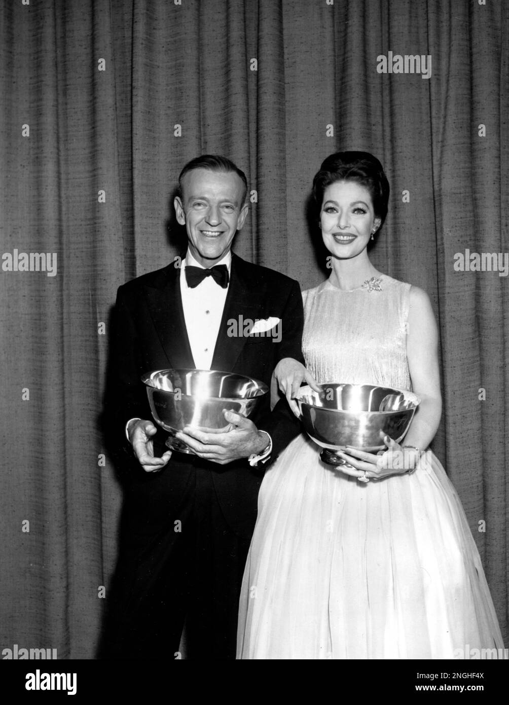 Actor Fred Astaire and actress Loretta Young pose at the TV Guide ...