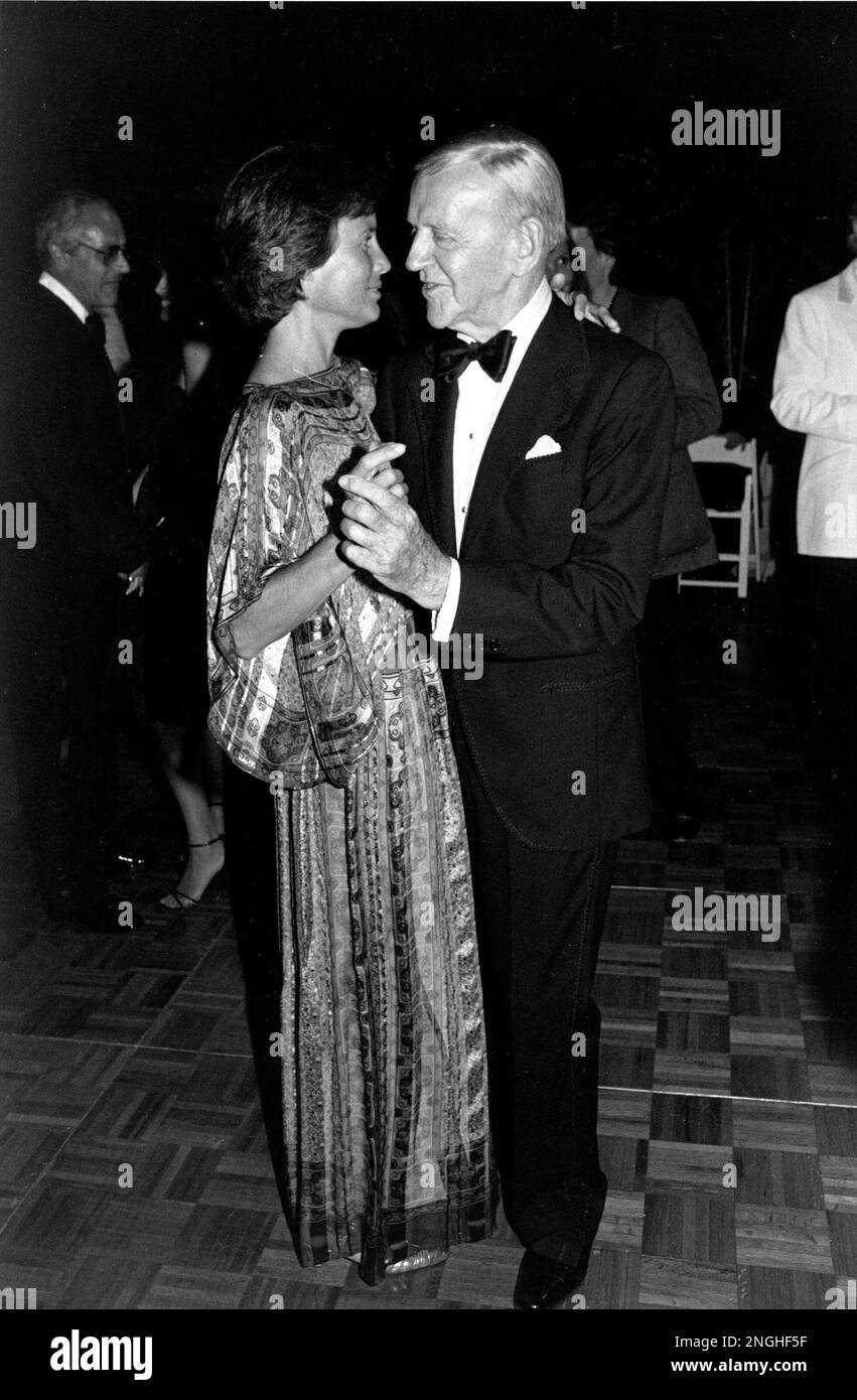 Actor Fred Astaire and his wife, Robyn, dance at a party following a ...