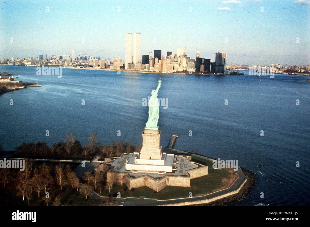 The Statue of Liberty, foreground, is seen in New York Harbor in 1980 ...