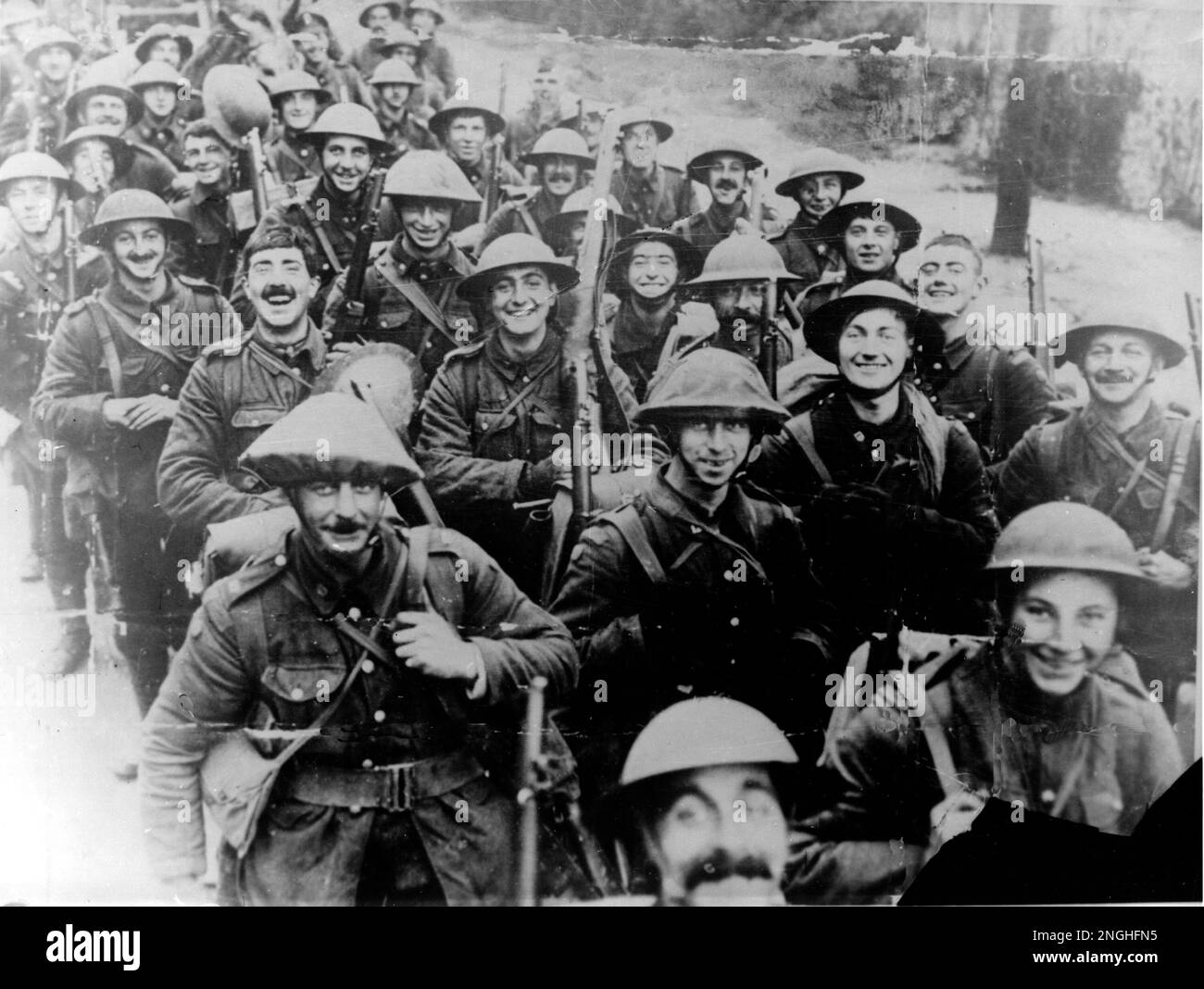 British Army soldiers smile as they march to the front lines in France ...