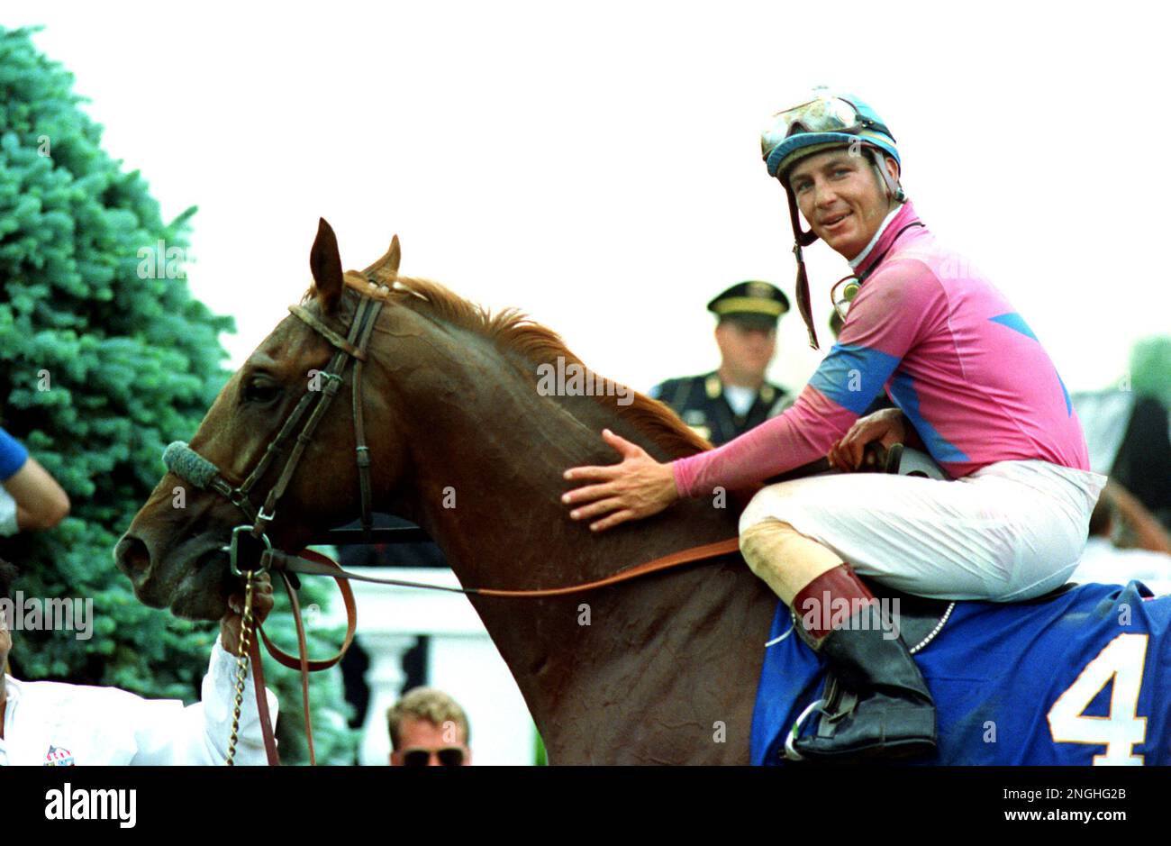 Jockey Chris Antley poses with Strike the Gold (4) in the winner's ...