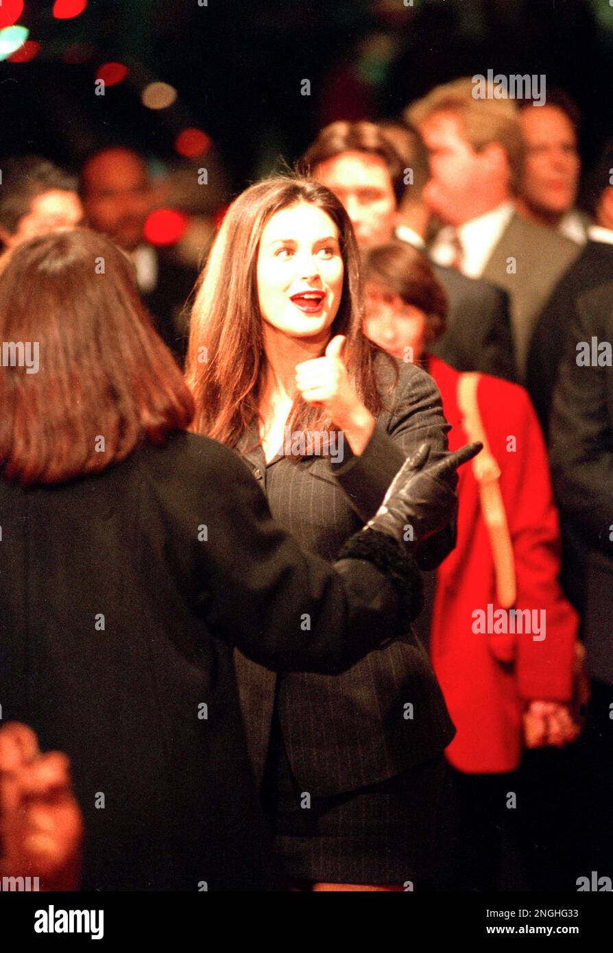 Actress Demi Moore gives the media a thumbs up during her arrival for a ...