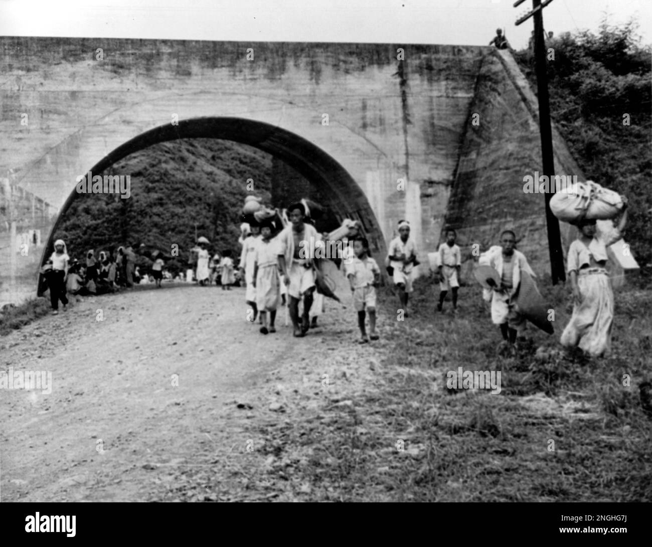 South Korean air force personnel and Korean civilians are shown heading ...