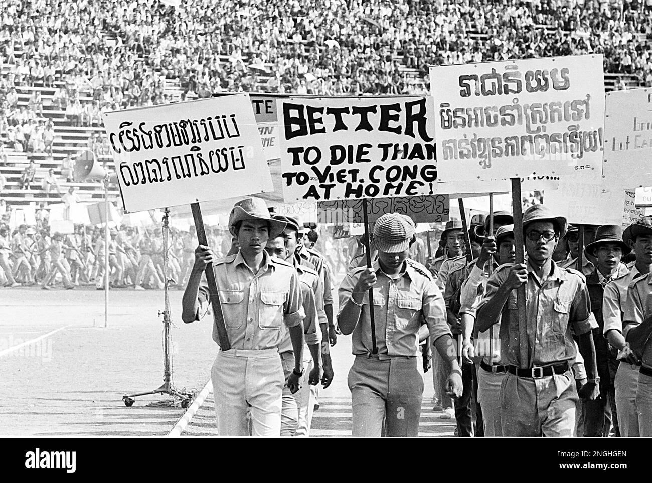 Cambodian militia carry anti Viet Cong signs with slogans denouncing ...