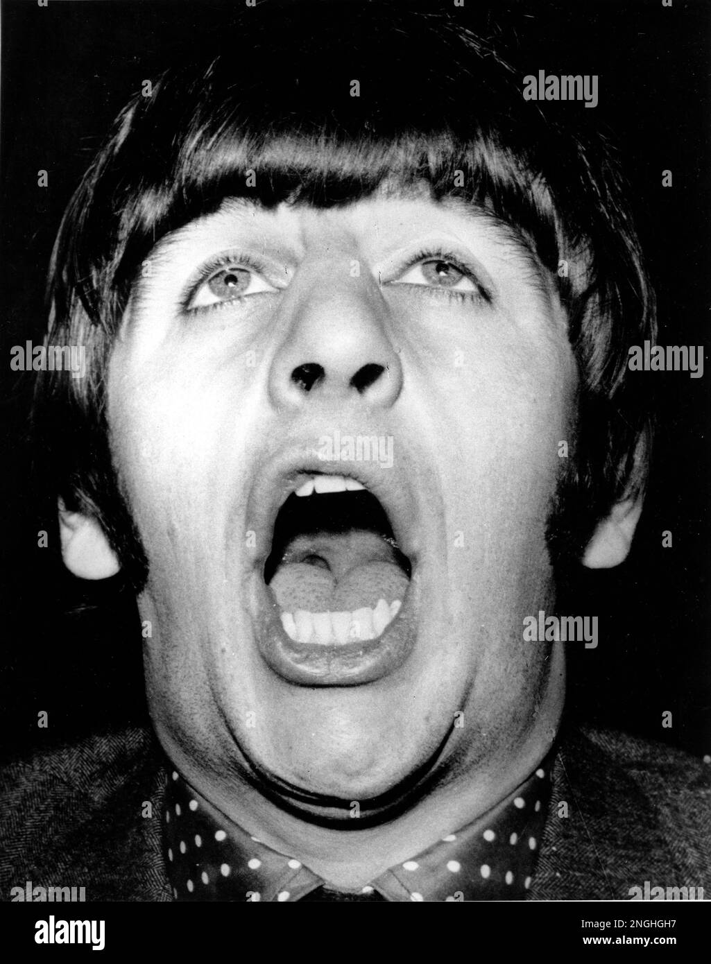 Beatles drummer Ringo Starr is photographed with his mouth wide open at ...