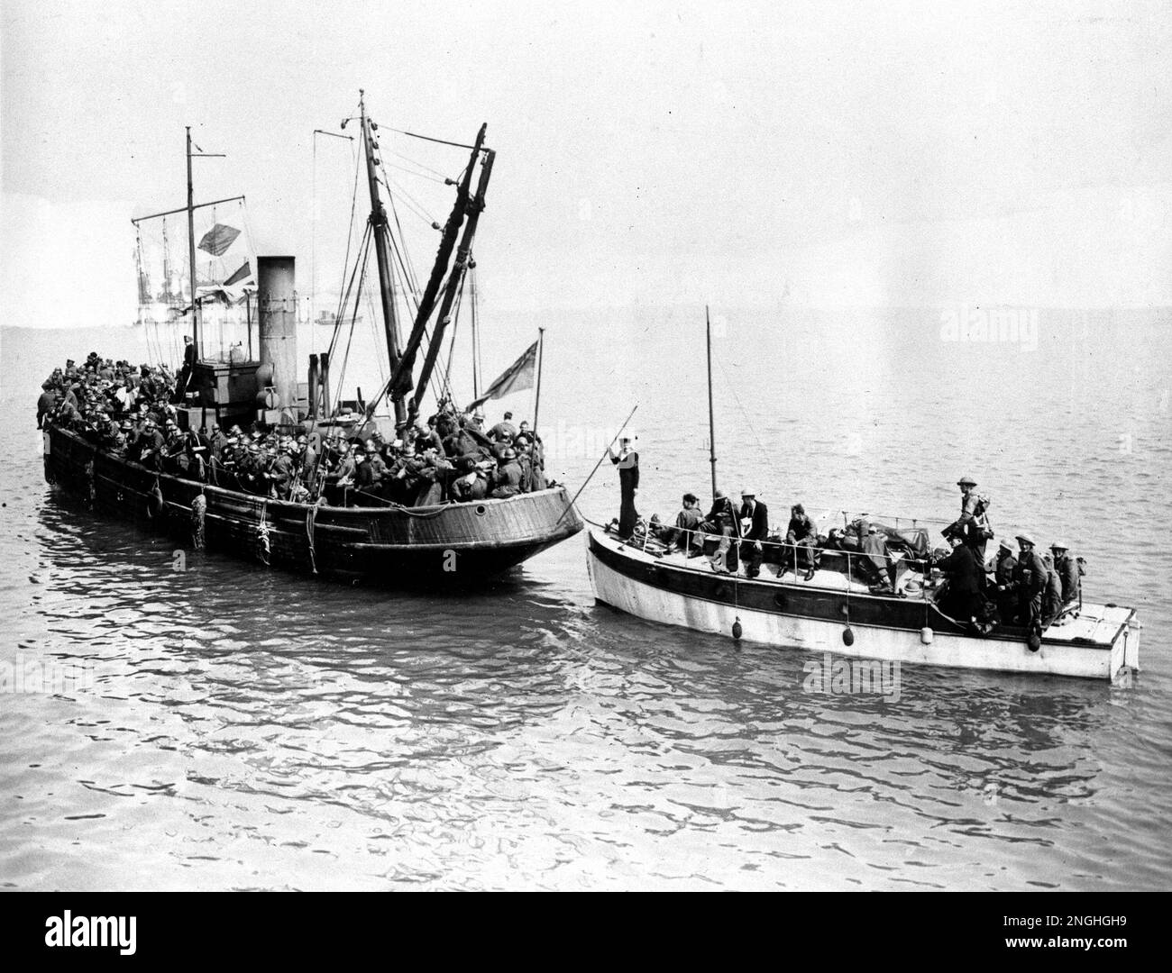 Two of the many small boats which helped to bring the Allied troops in ...