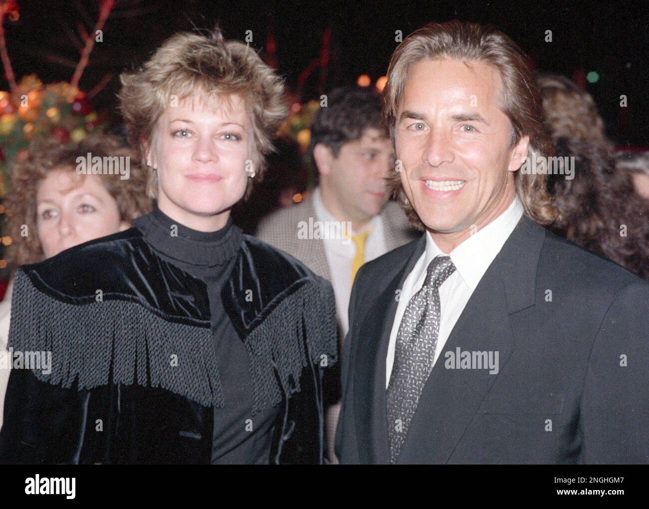 Actress Melanie Griffith, left, and actor Don Johnson pose at a party ...