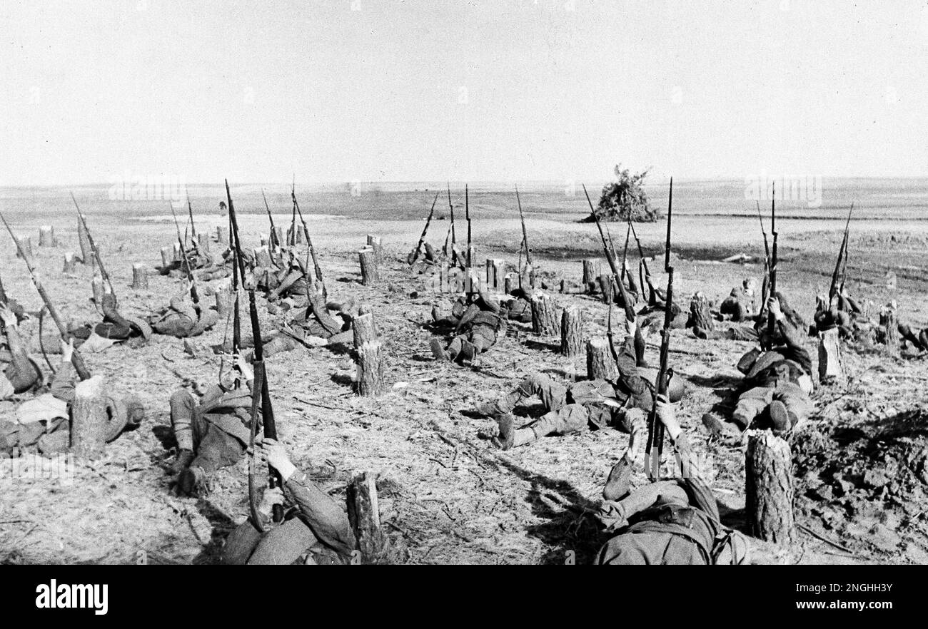 A group of Soviet Communist soldiers aim their rifles skyward at German ...