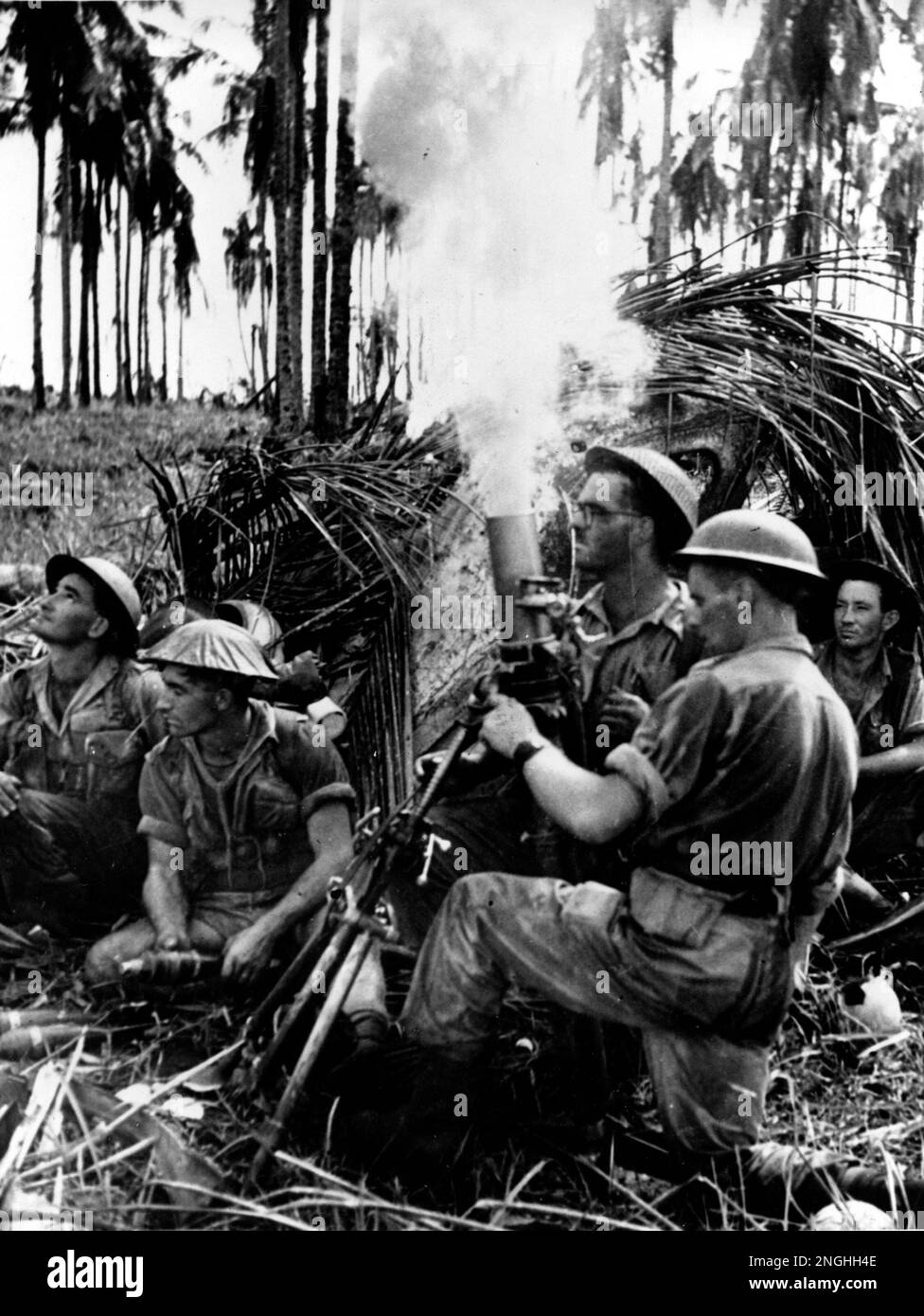 An Australian mortar crew sends out a barrage of mortar fire on ...