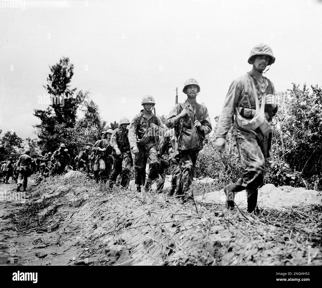 U.S. Marine raiders return to base camp after an all-night vigil in ...