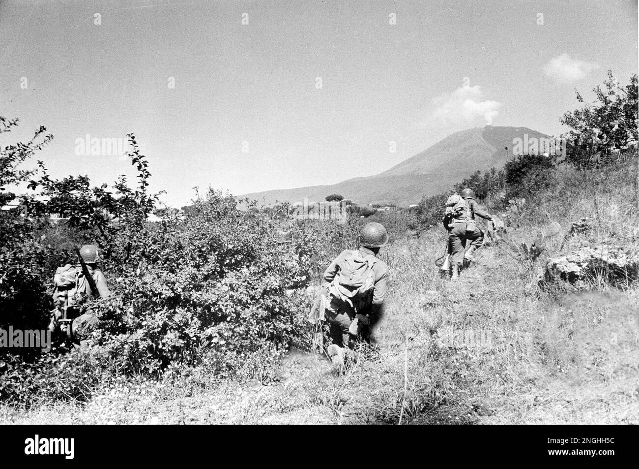American infantrymen advance on a German observation post within sight ...