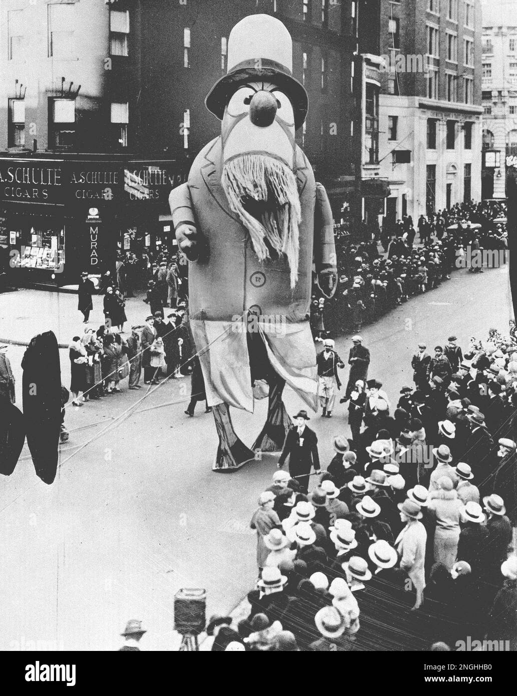 A large outdoor float of Captain Nemo makes its way down the street ...