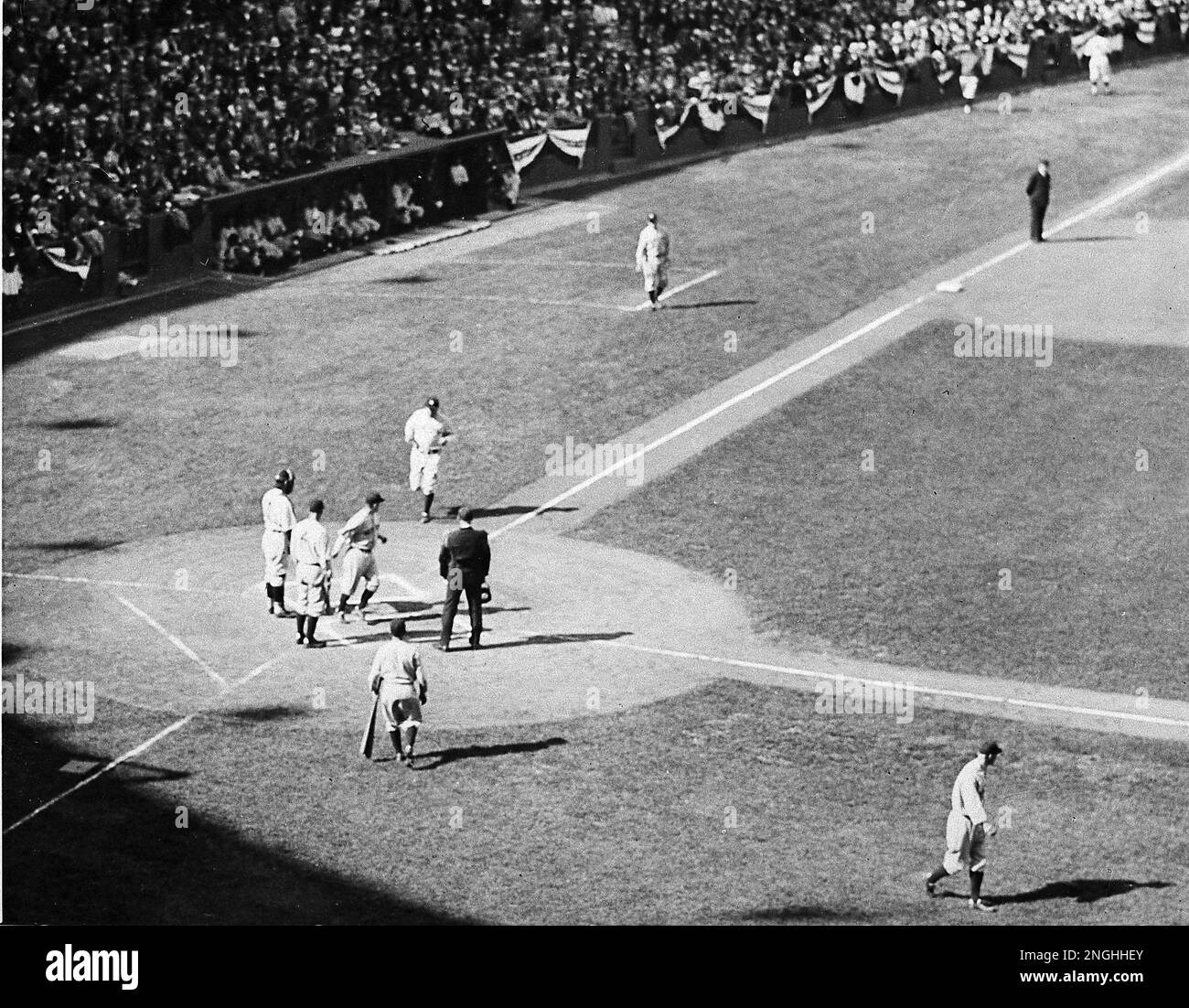 Babe Ruth of the New York Yankees crosses the plate after a home run in ...