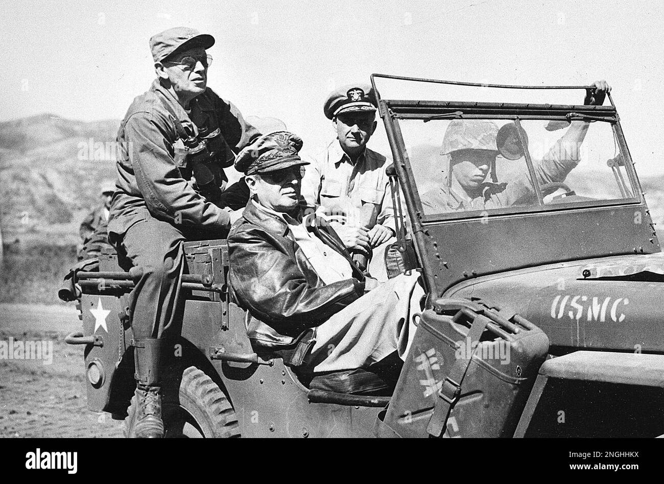 Gen. Douglas MacArthur, in passenger seat wearing leather jacket, tours ...