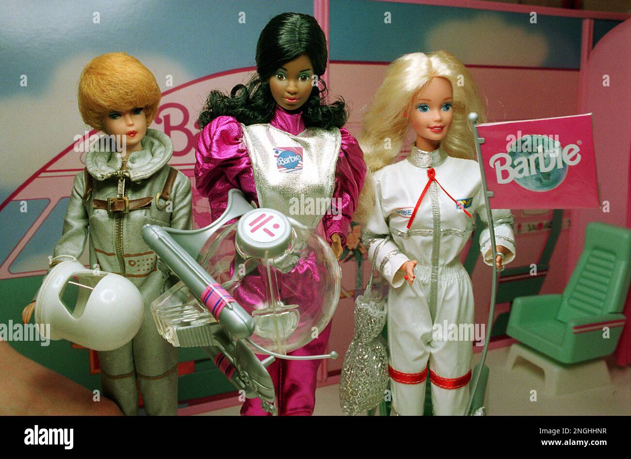 Astronaut Barbie dolls, from left, 1960s, 1980s and 1990s, are on ...