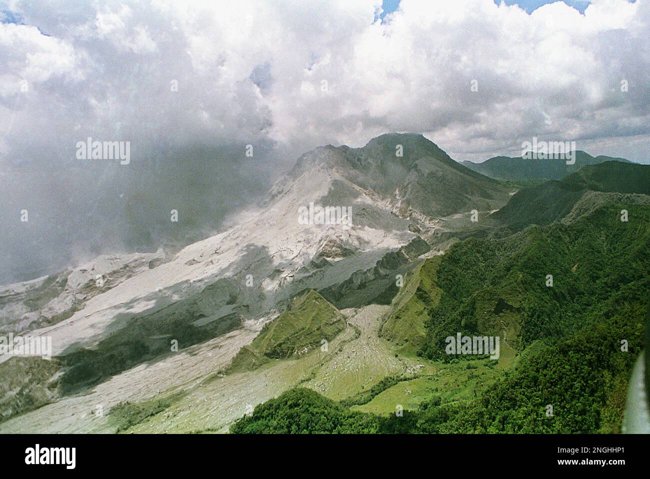 A huge area of ash flow dominates what used to be the green mountain ...