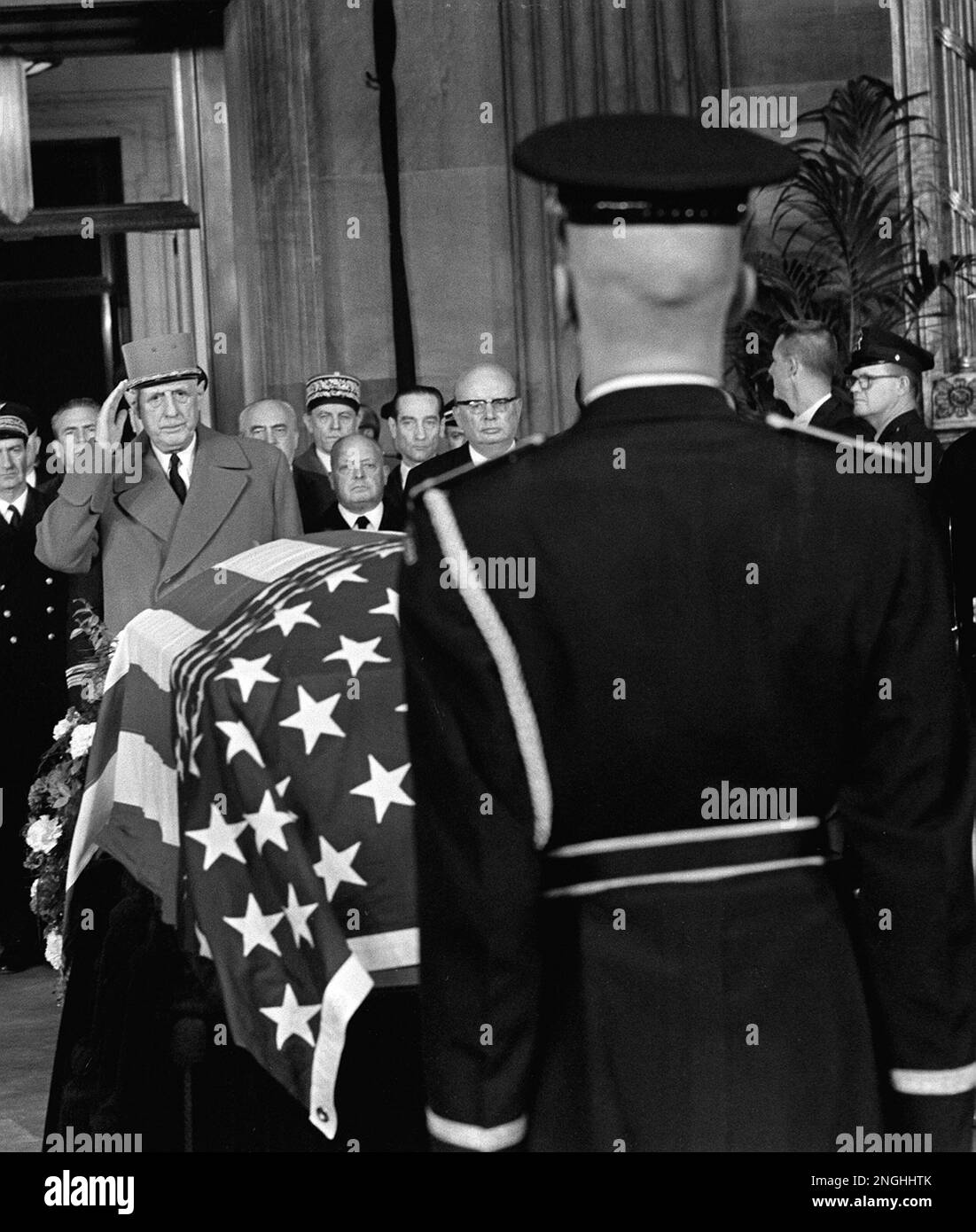 French President Charles de Gaulle salutes the flag draped coffin of ...