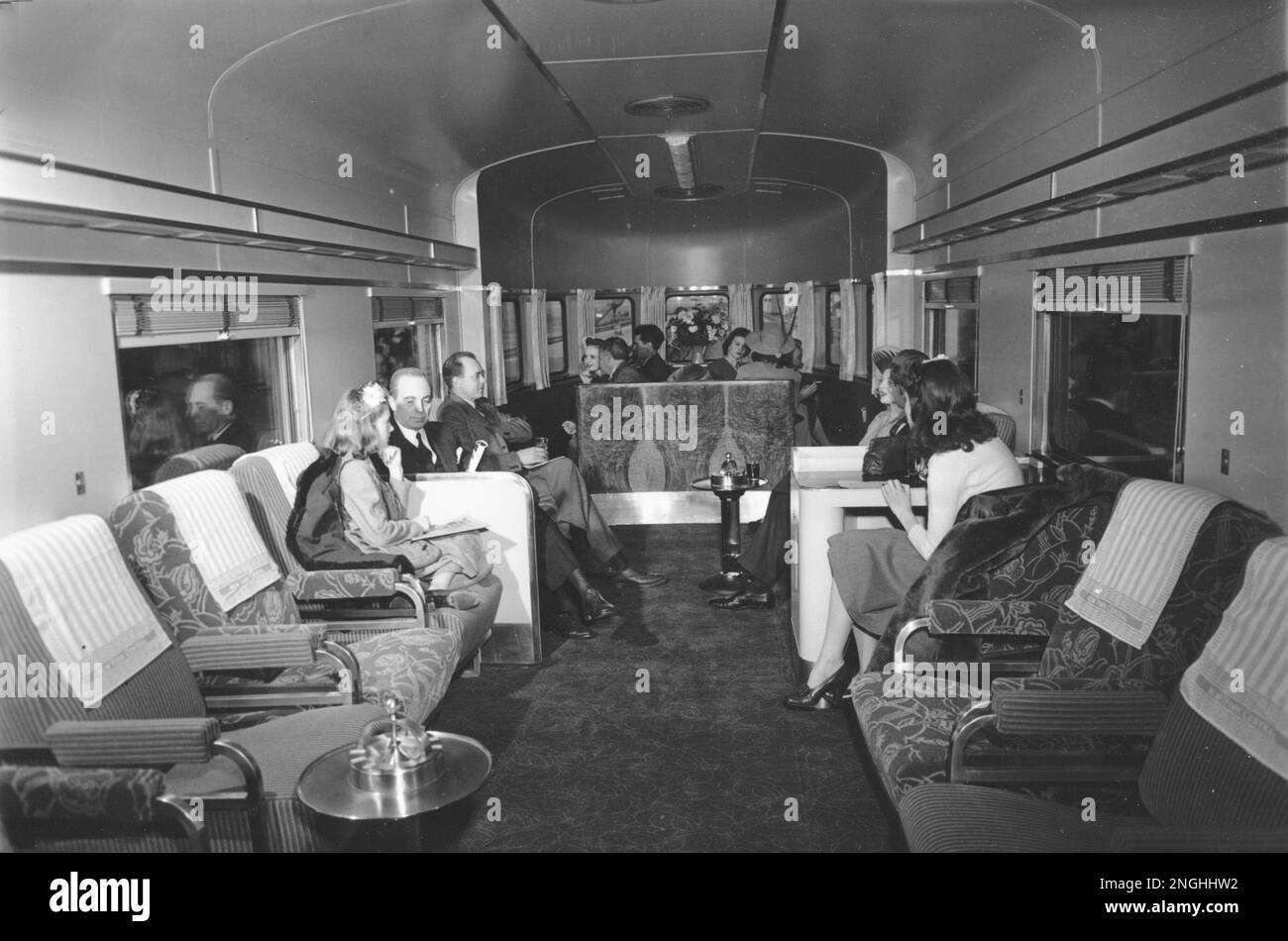 Passengers sit in the observation lounge car in the streamlined new ...