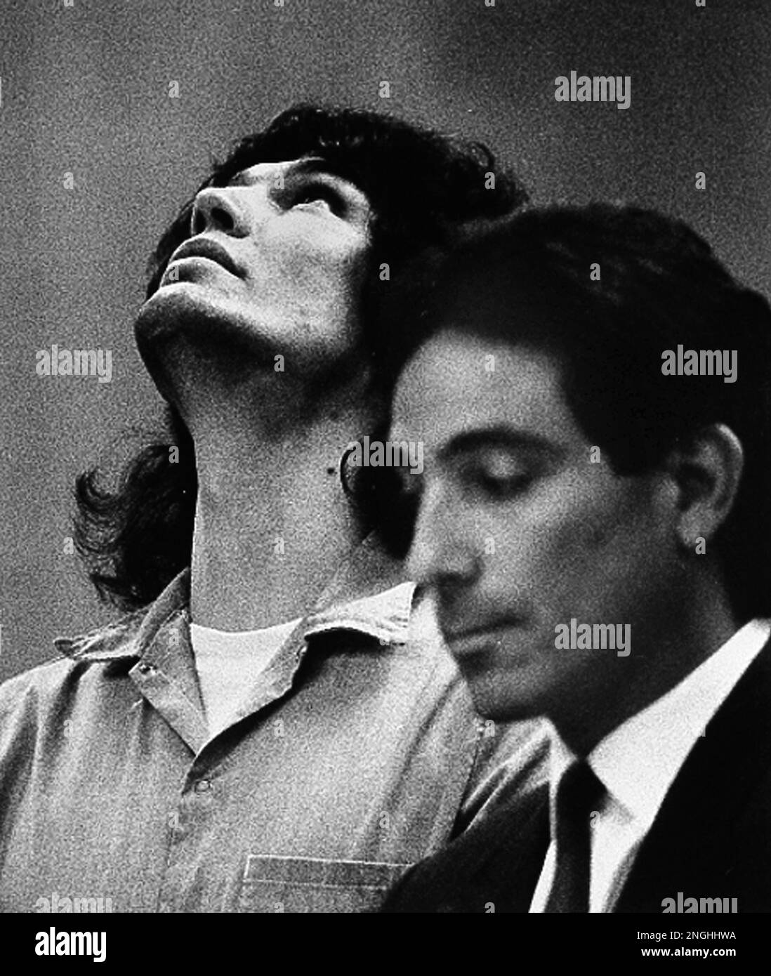 Richard Ramirez, the devil-worshipping "Night Stalker," looks up as he ...