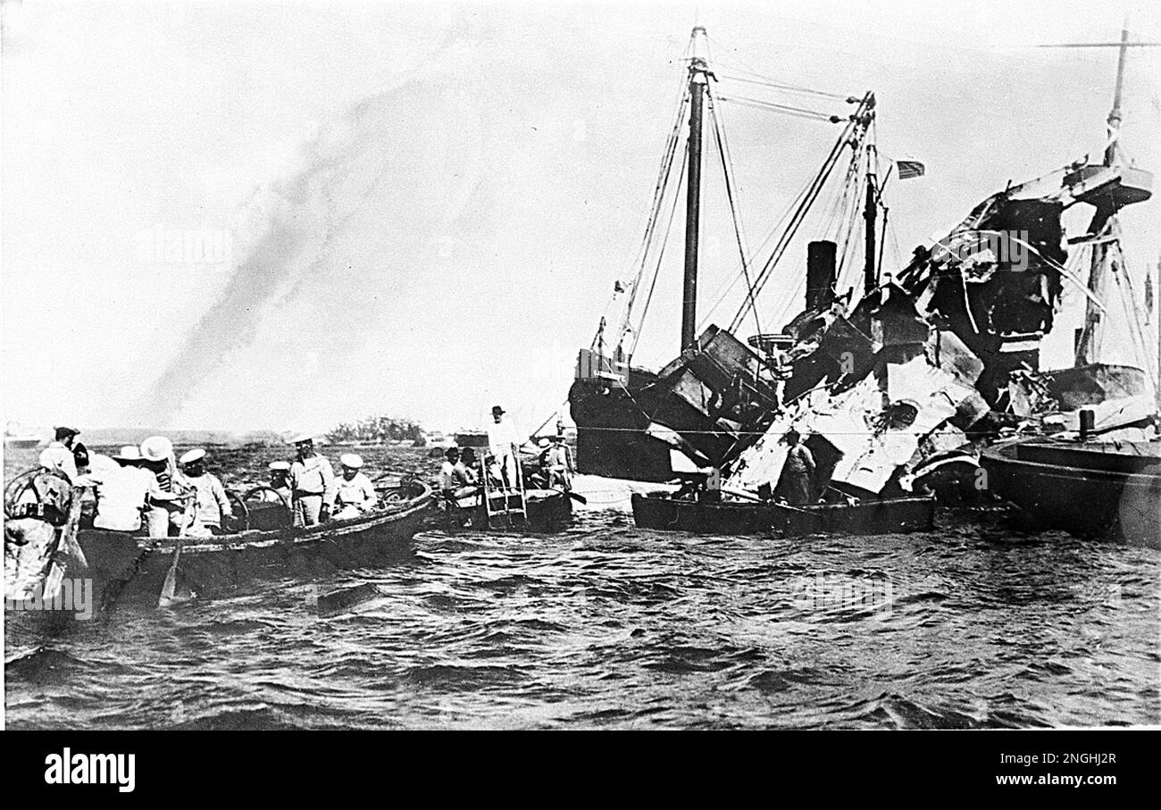 Lifeboats rescue surviving crewmen of the wrecked USS Maine after an ...