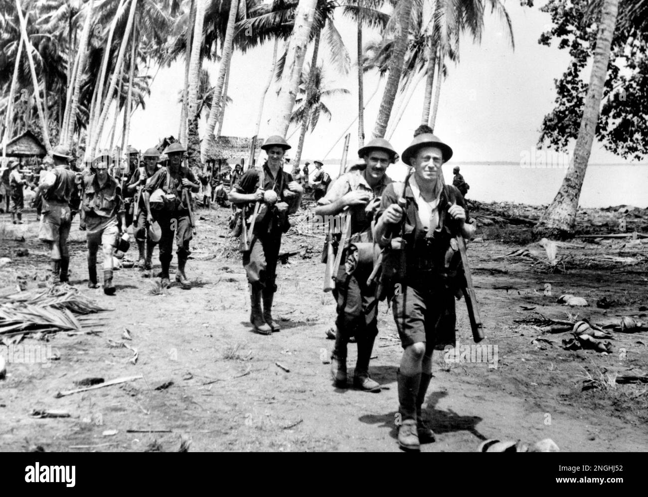 Australian troops move down the coast of New Guinea for the assault on ...