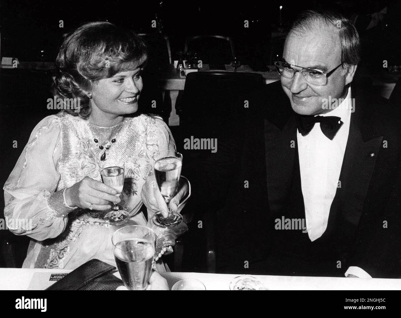 Hannelore Kohl, left, and her husband Helmut Kohl, right, with a glass ...