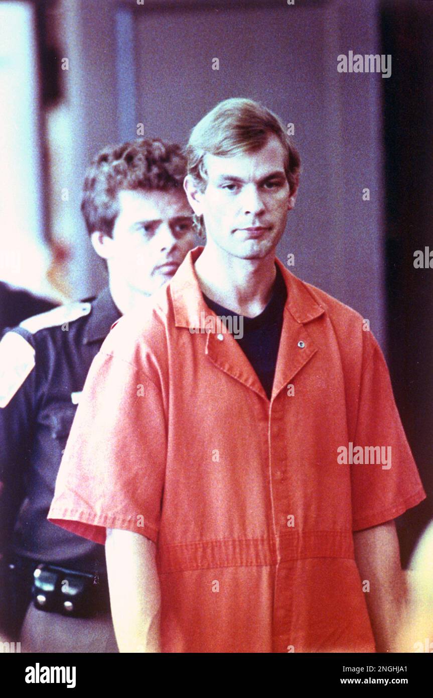 Accused serial killer Jeffrey L. Dahmer walks into the Milwaukee County ...