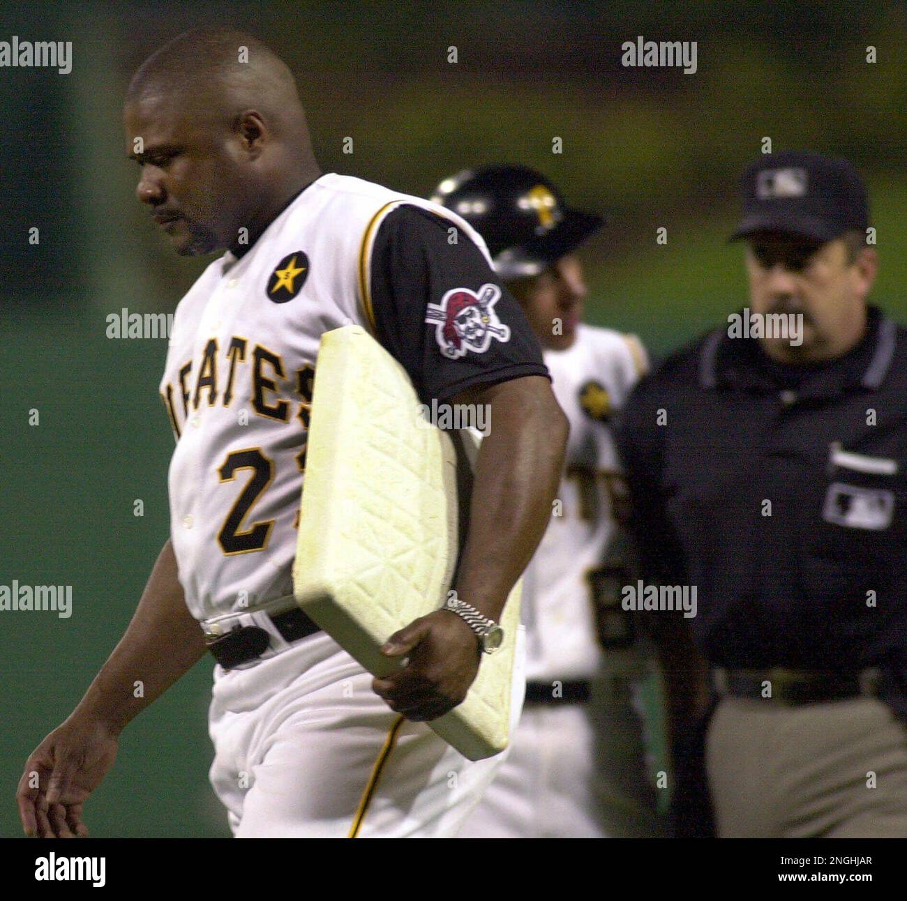 Pittsburgh Pirates manager Lloyd McClendon walks off the field carrying ...