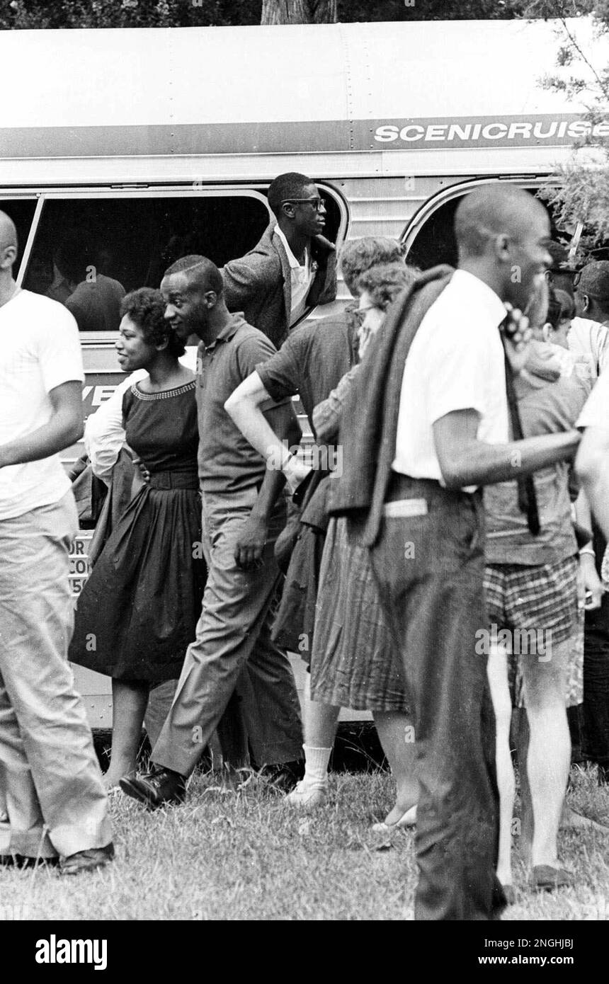 An unidentified "Freedom Rider" sticks his head out of a chartered bus ...