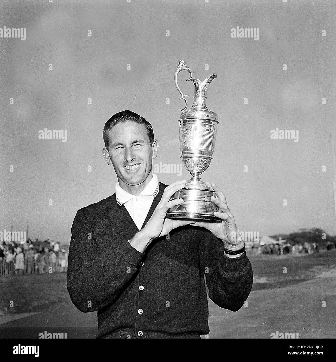 Bob Charles poses with his British Open Golf Championship trophy cup at ...