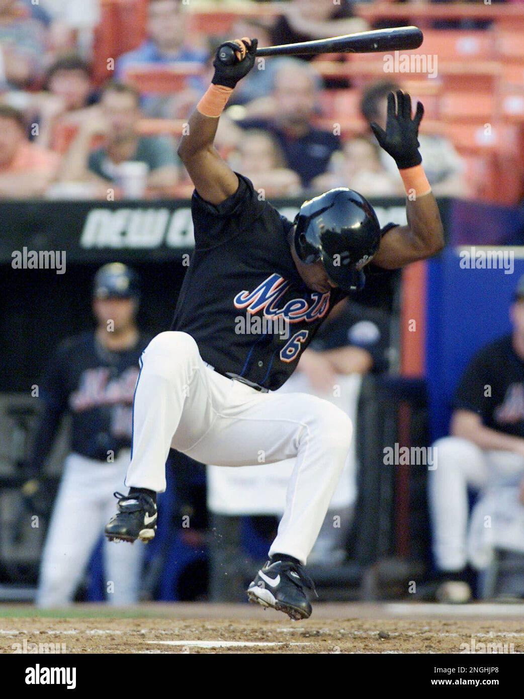 New York Mets' Timo Perez is knocked off his feet after being hit by a ...