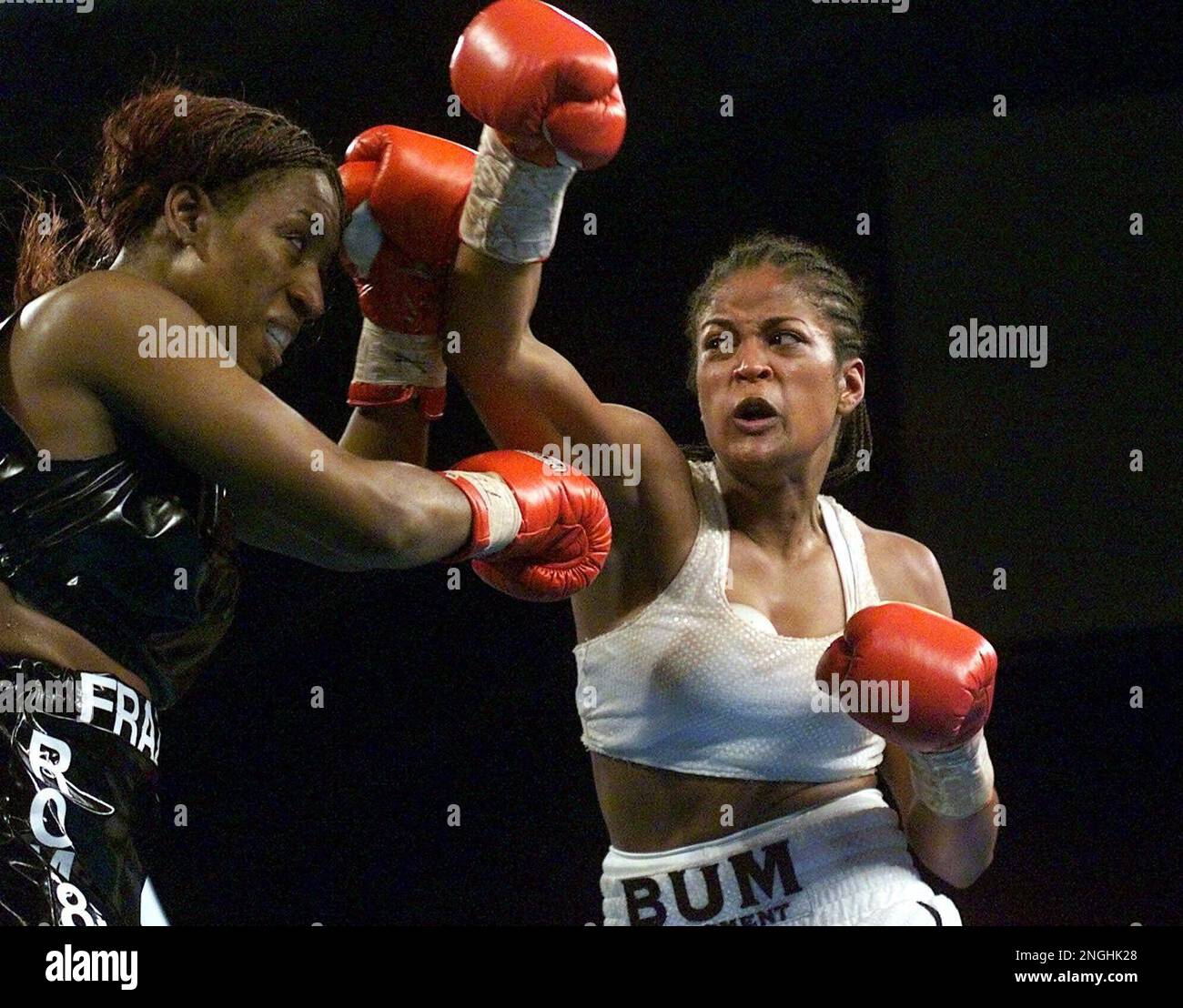 Jacqui Frazier-Lyde, left, deflects a punch from Laila Ali during their ...